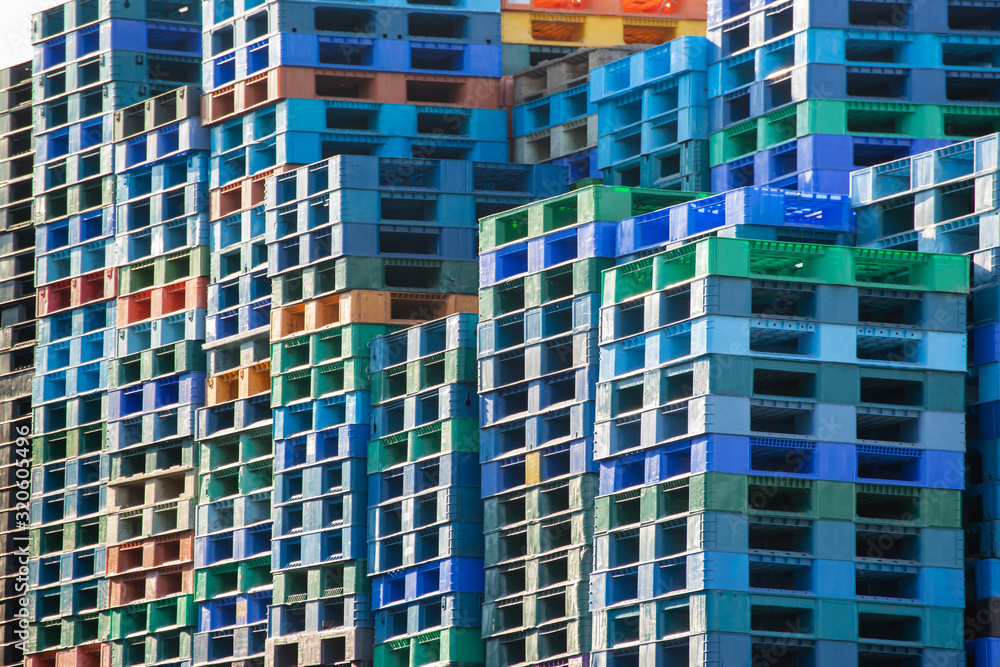 Industry plastic pallet stacked in factory warehouse for logistic ...