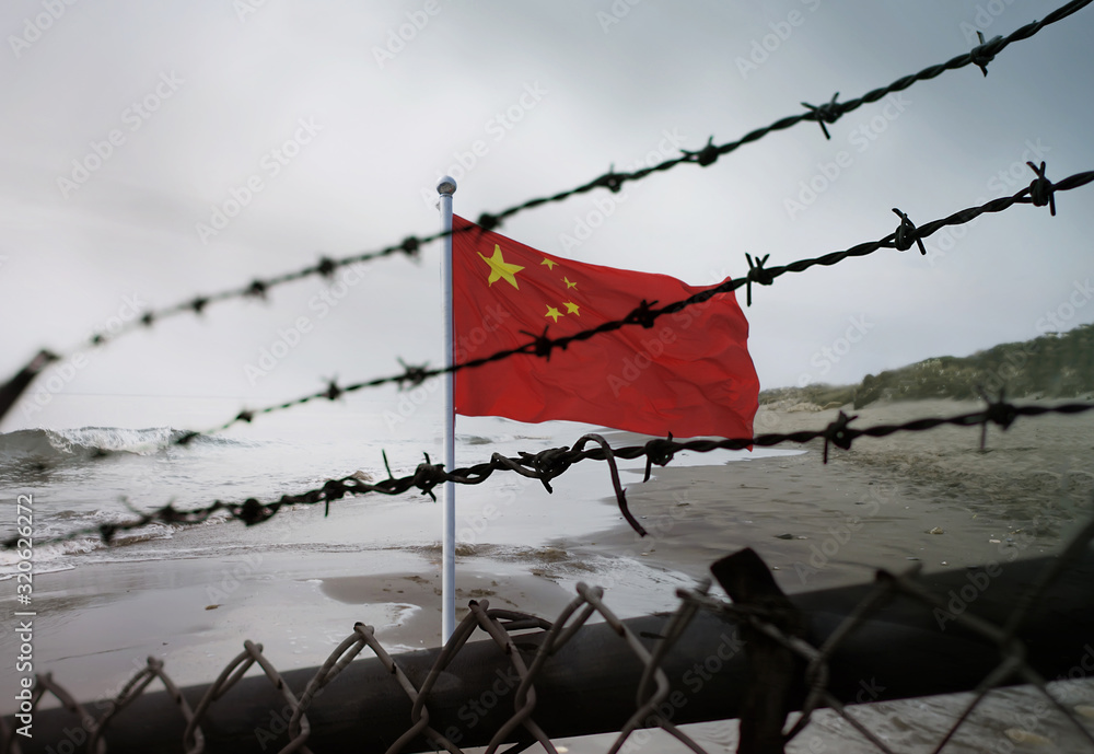 China border fence. Chinese flag behind a steel wire mesh Stock Photo ...