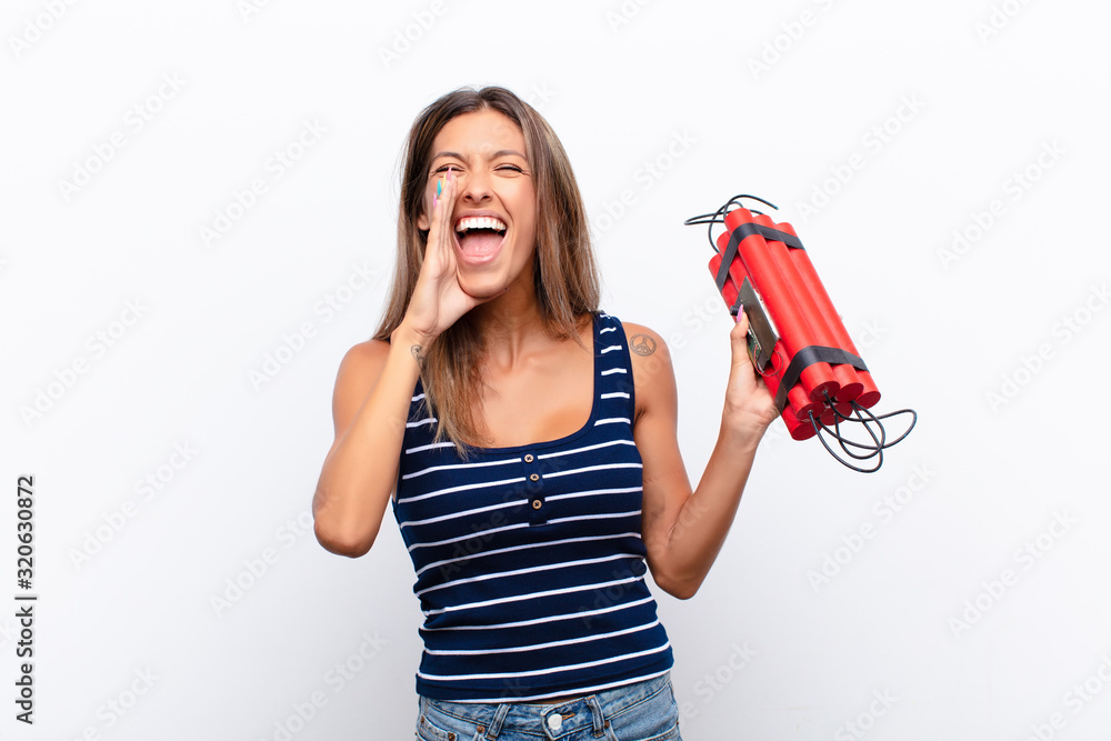 young pretty woman feeling happy, excited and positive, giving a big ...