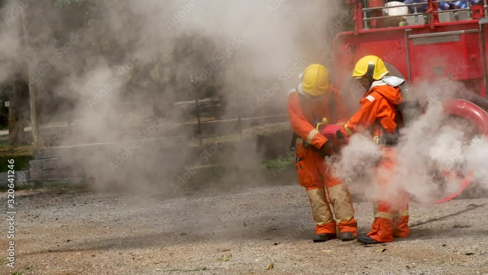 Vidéo Stock Firefighter fighting with fire flame protection property ...