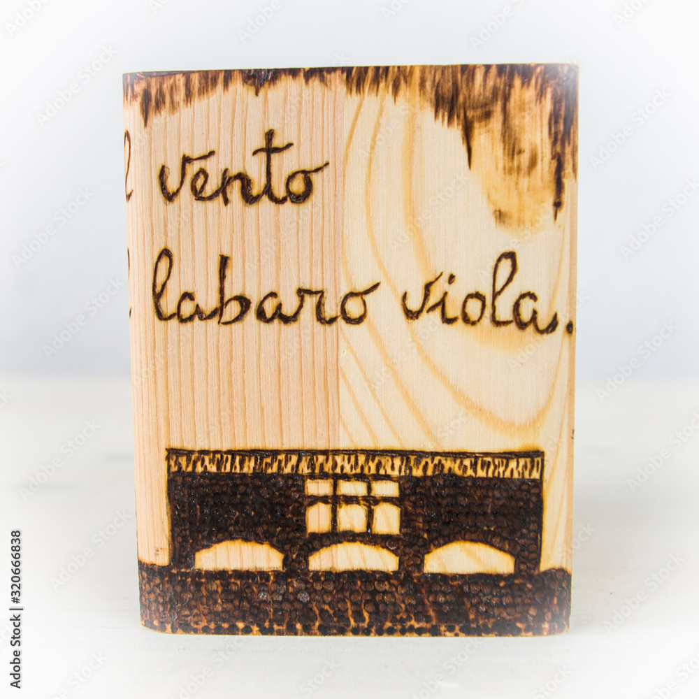 the ancient art of pyrography, wood and fire, the symbols of the city ...