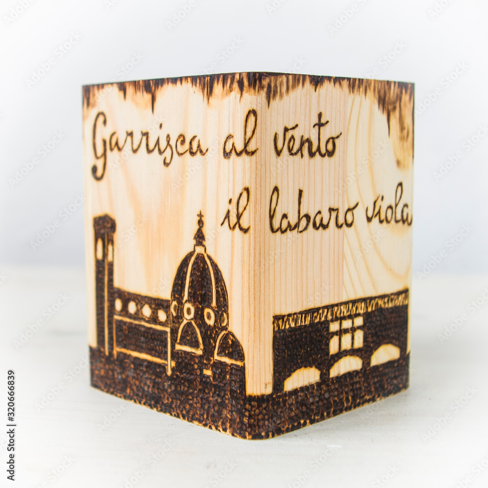 the ancient art of pyrography, wood and fire, the symbols of the city ...