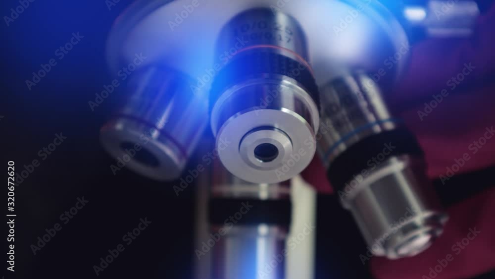 Laboratory microscope for science. The scientist twists the eyepieces ...