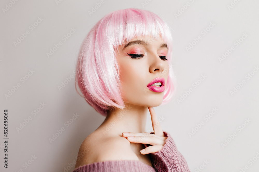 Beautiful dreamy woman wears pink peruke posing with eyes closed ...