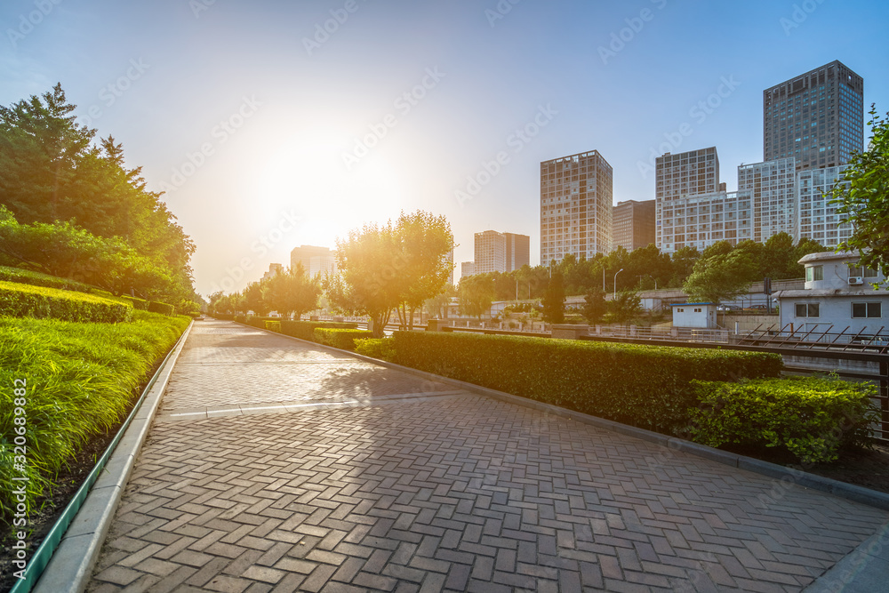 park pedestrian walkway and modern skyscrapers, beijing city, china ...