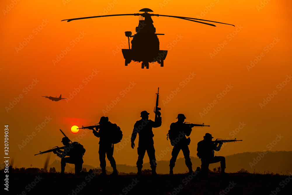 Silhouette of military rangers and Helicopter with soldier on the top ...