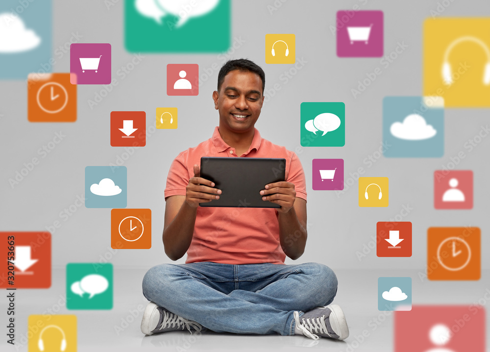 technology and people concept - happy indian man with tablet computer ...