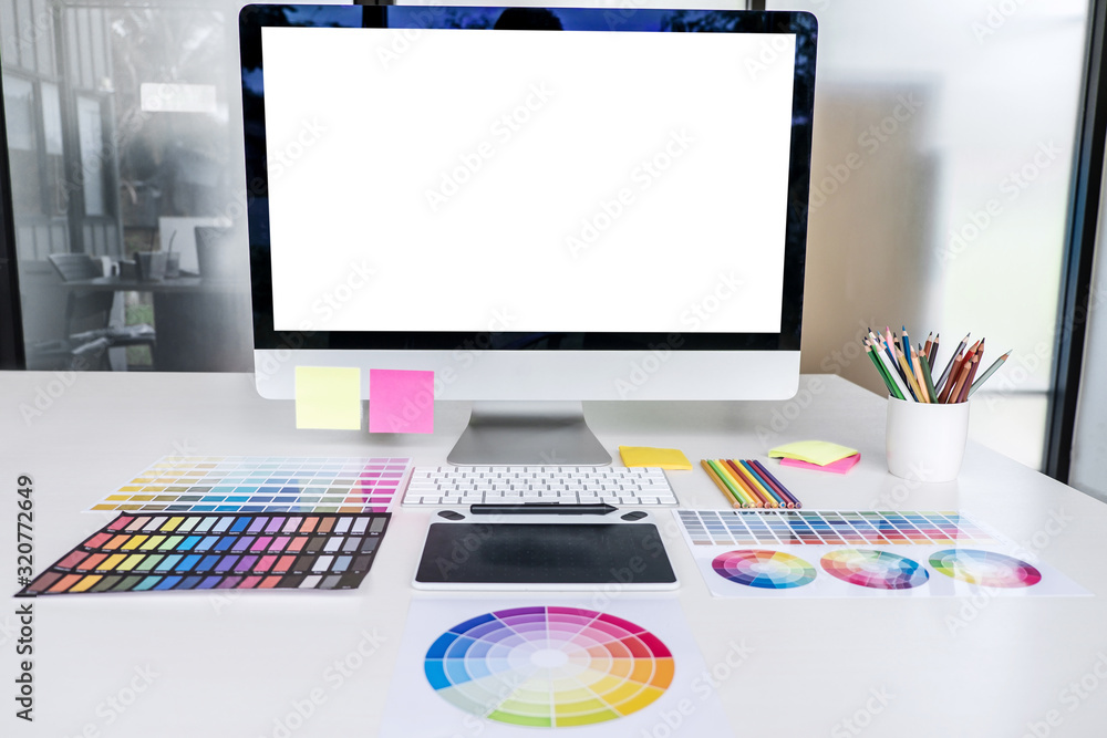 Desktop computer screen on white desk, Graphic designer and color ...