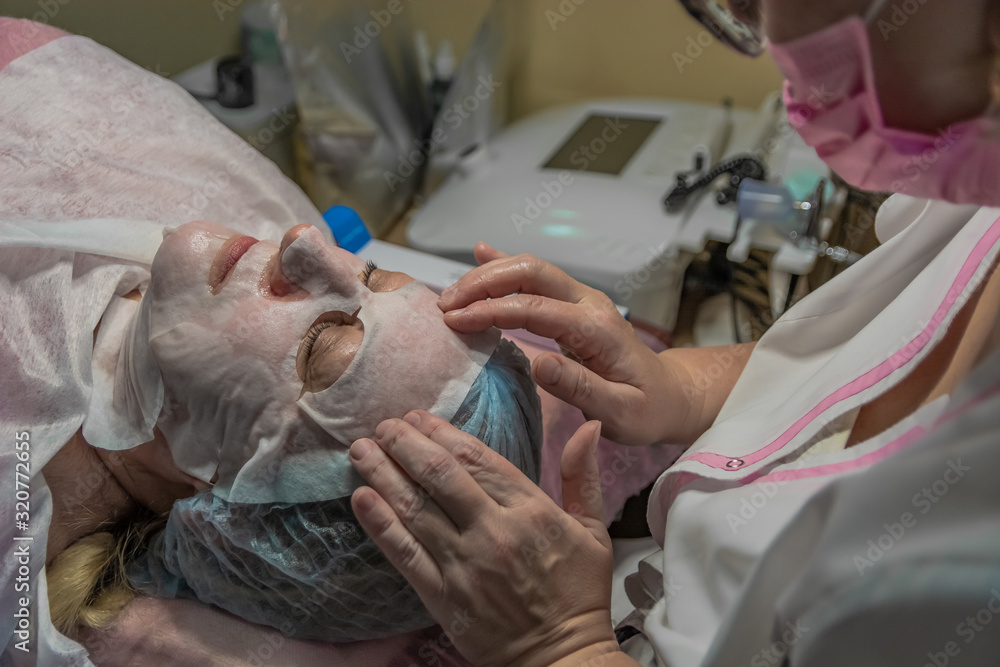 Non-invasive face carboxytherapy in a beauty salon. It is performed for ...