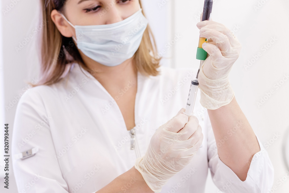 Scientist holding test tube with blood in laboratory. Beautiful female ...