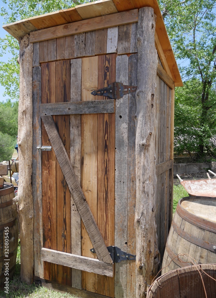 New wooden outhouse structure sold at a flea market Stock Photo | Adobe ...