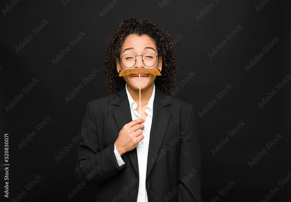 young latin woman with a goofy, crazy, surprised expression, puffing ...
