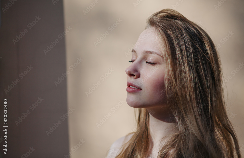 Lifestyle portrait of a beautiful blonde white girl ouside in natural ...
