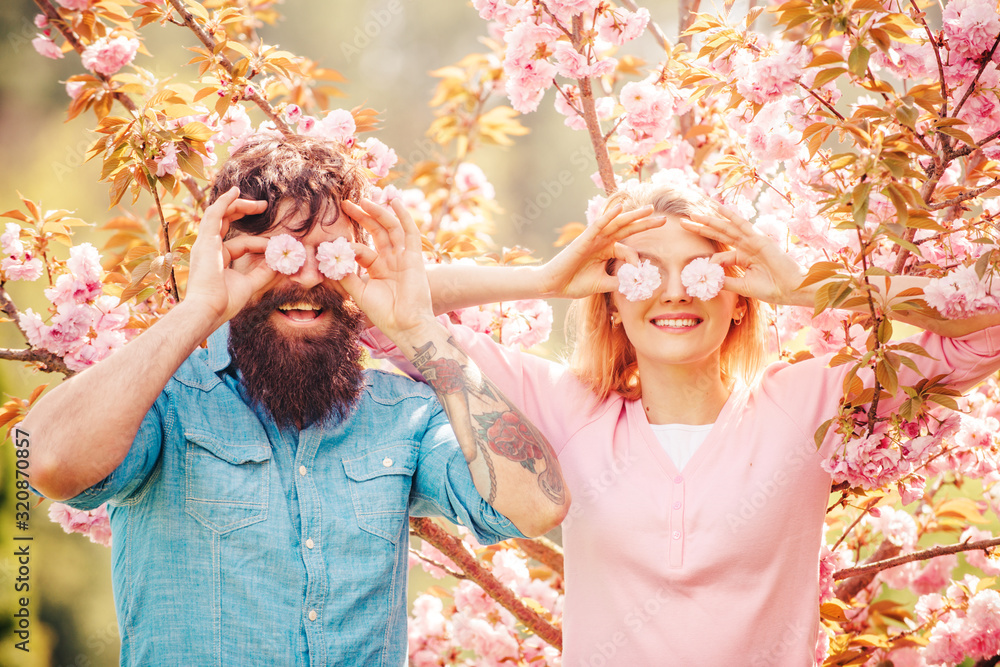 Smiling couple in love on blossoming tree garden background. Man Couple ...