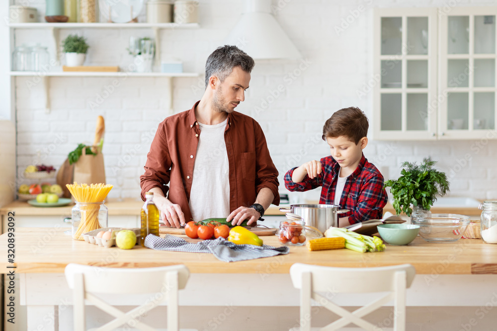 Father and son cooking homemade food together Stock Photo | Adobe Stock