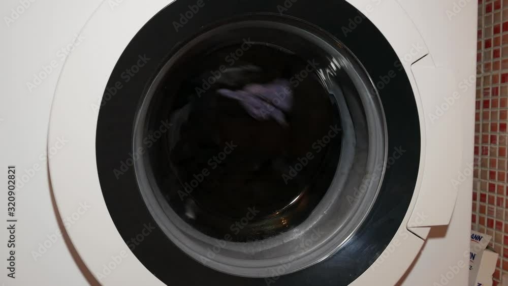 Cylinder Spinning of washing machine. Loaded Washing Machine. Concept ...