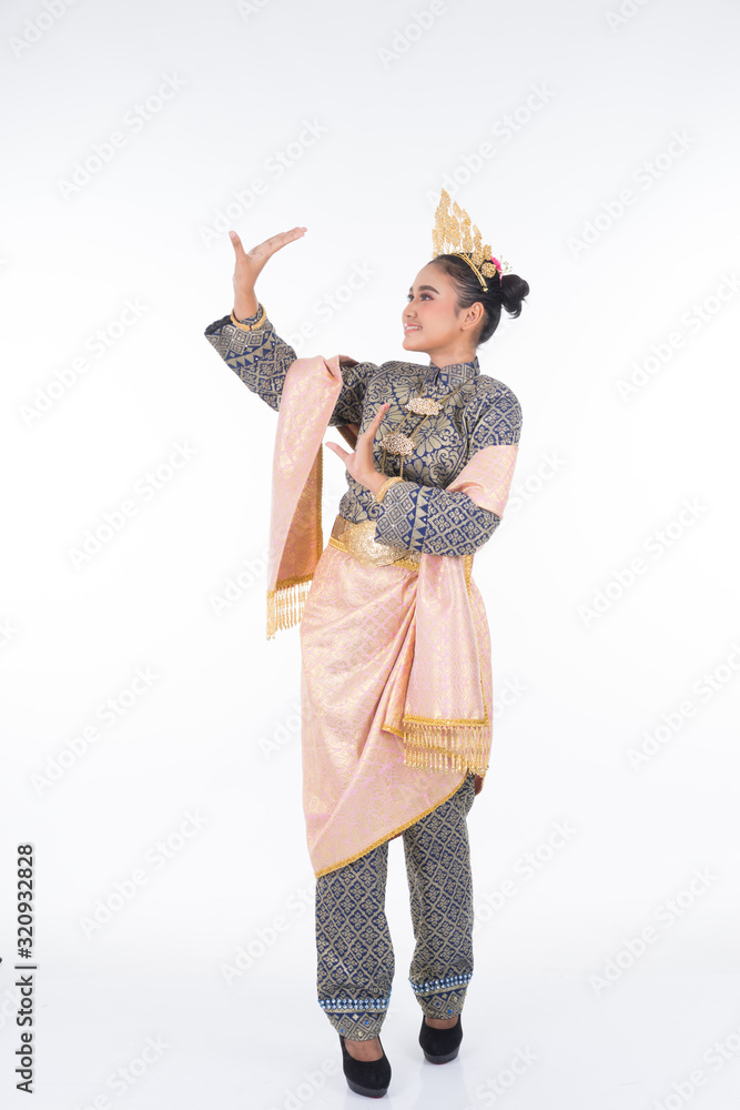 A beautiful Malaysian traditional female dancer performing the dance ...