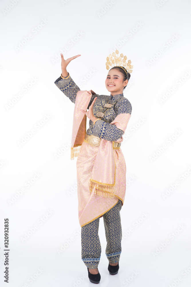 A beautiful Malaysian traditional female dancer performing the dance ...