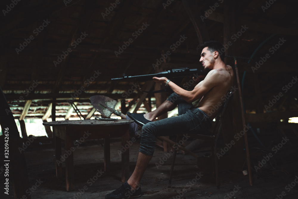 Mafia member fire on the rooftop with a long barrel gun. Stock Photo ...