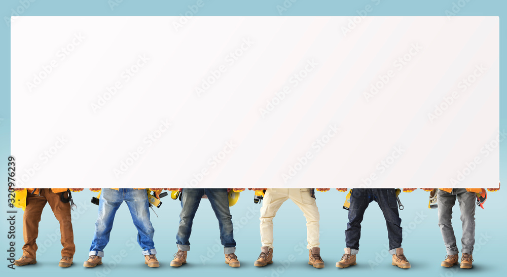 Builders with tools in construction clothing hold a heavy slab Stock ...