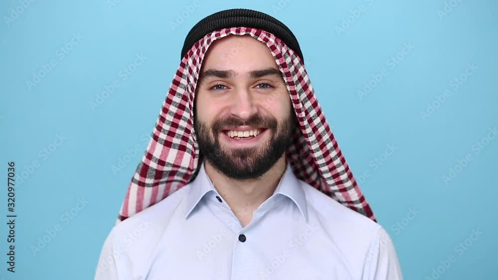 Bearded young arabian muslim man 20s in keffiyeh kafiya ring igal agal ...