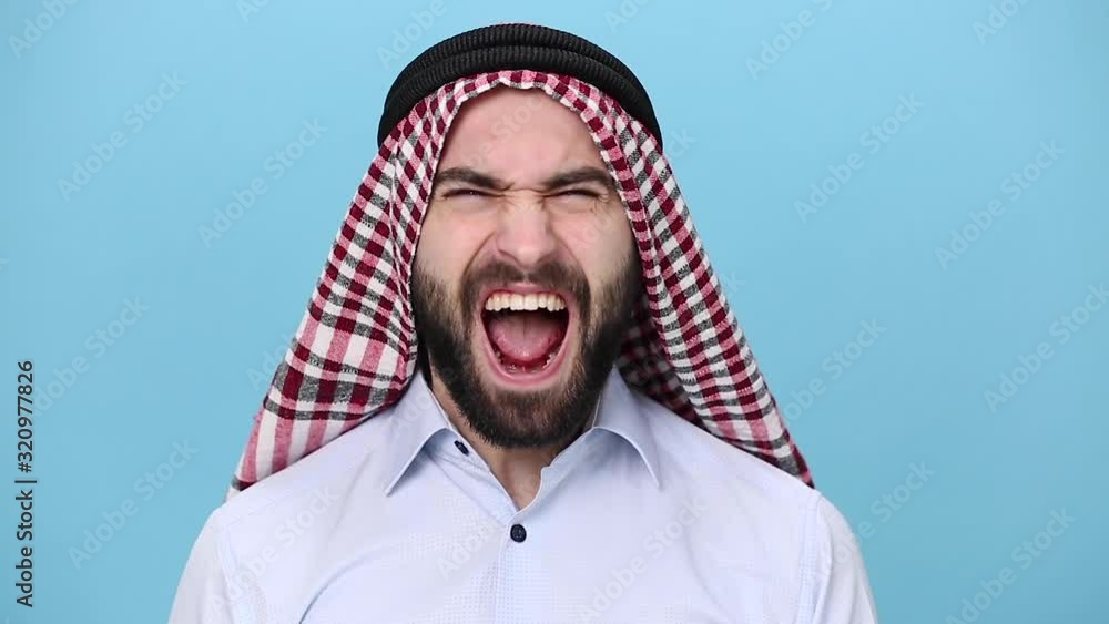 Bearded young arabian muslim man 20s in keffiyeh kafiya ring igal agal ...