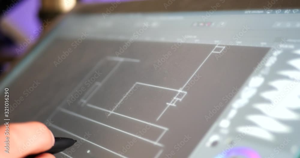 An architect drafting out blueprints or concept art for a building ...