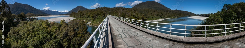Road to Jackson bay. Westcoast New Zealand. Bridge Okuru river ...