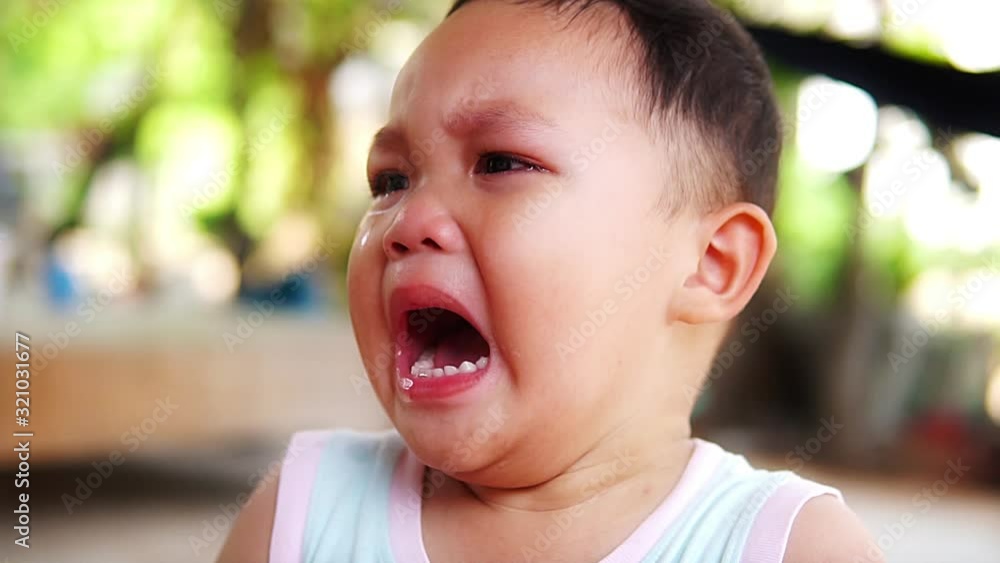 Vidéo Stock Asian boy crying with tears, feeling scare sadness and ...