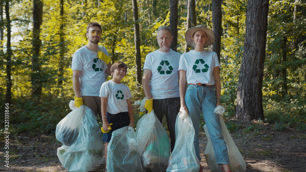 Portrait volunteers activists people in gloves tidying up rubbish ...