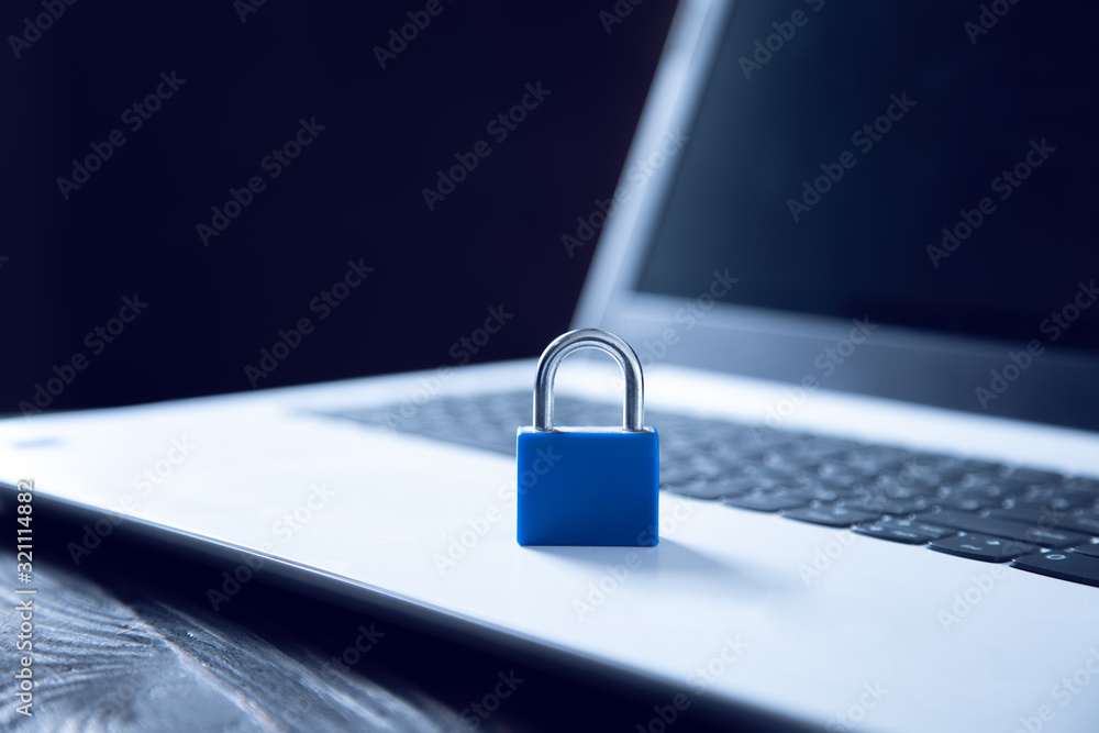 blue lock on the laptop on the desk Stock Photo | Adobe Stock