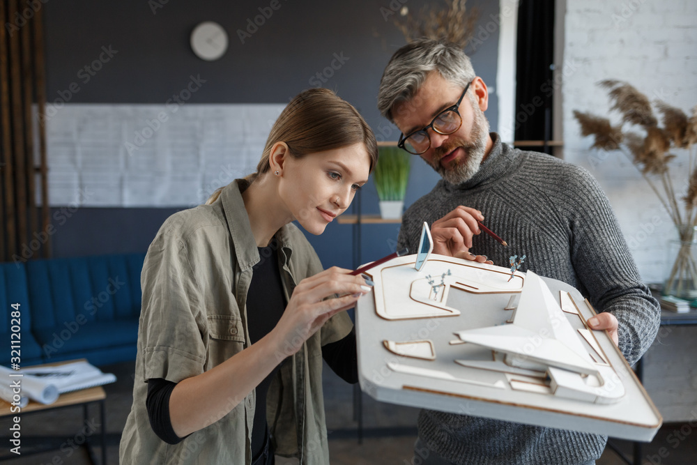 3d architects team working in office with building 3d model. Architects ...