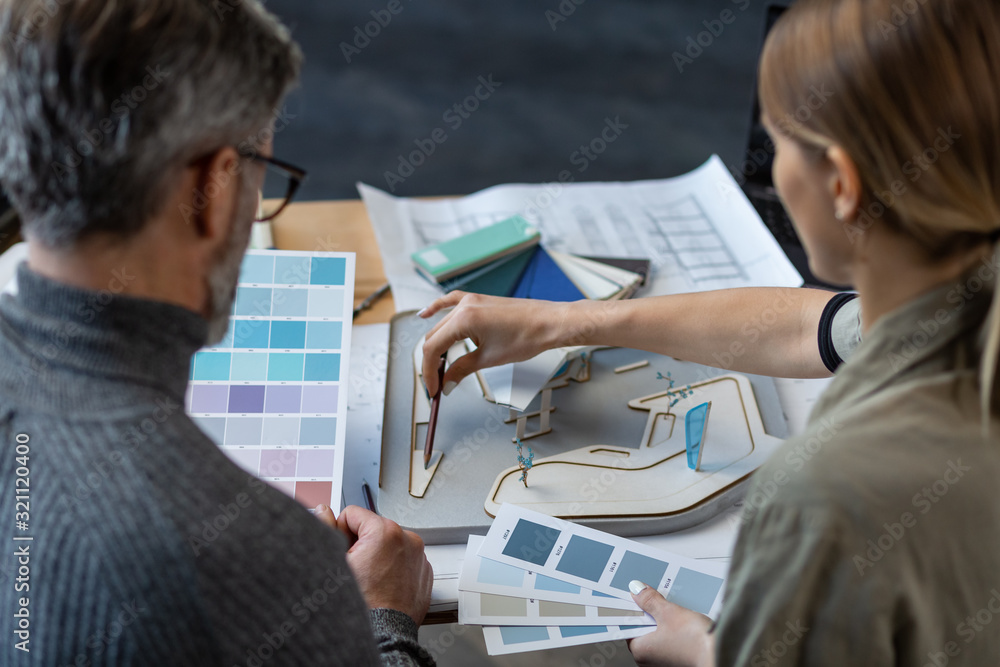 Interior designers team working in office with color palette ...