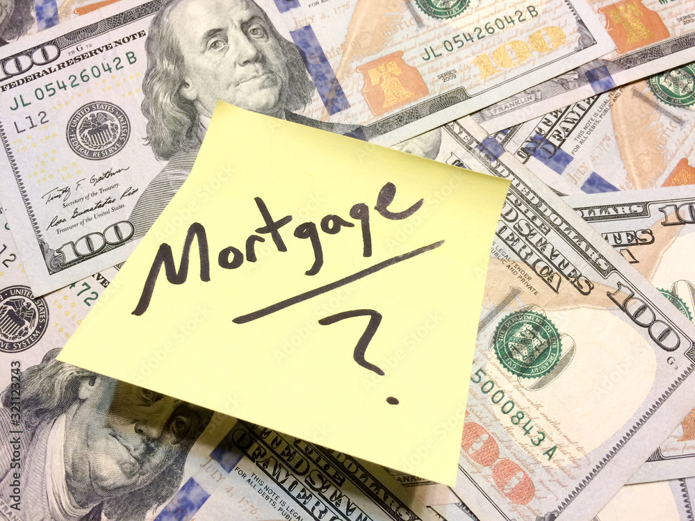 American cash money and yellow post it note with text Mortgage with ...