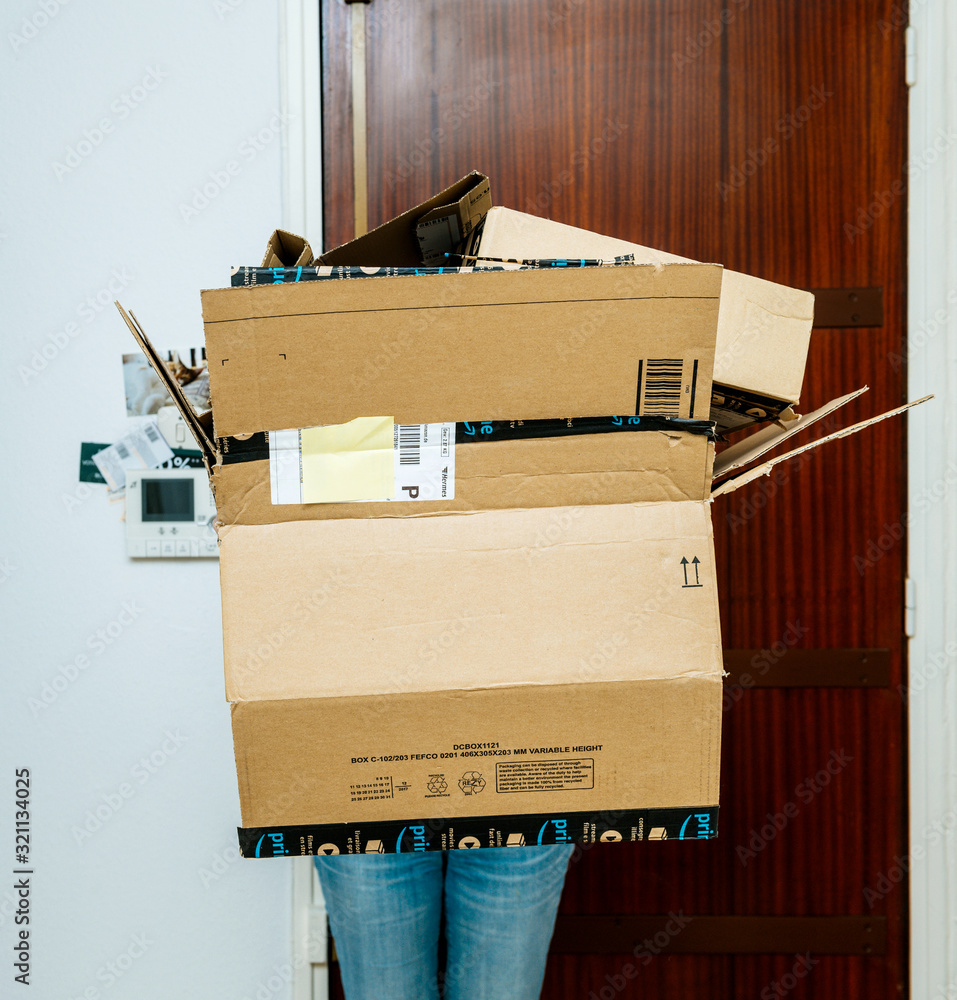PARIS, FRANCE - JAN 13, 2018: Square image of woman holding stack of ...