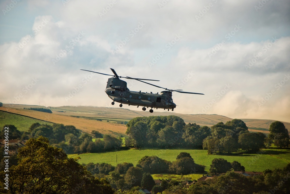 Chinook helicopter in flight, flying over the Peak District countryside ...