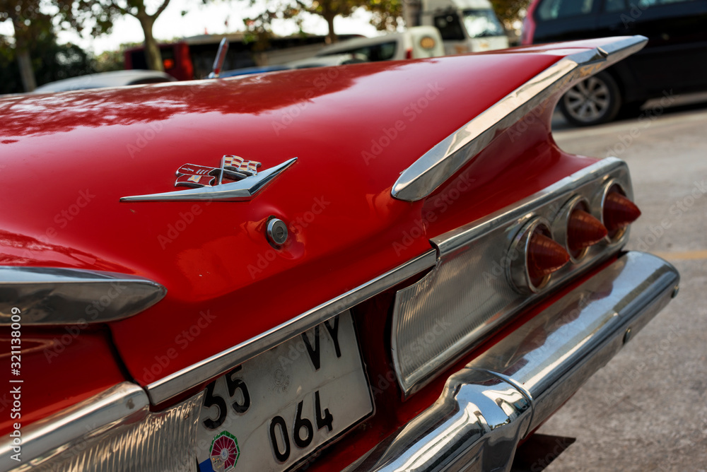 Rear view of a red colored 1960 Chevrolet Impala. Stock Photo | Adobe Stock