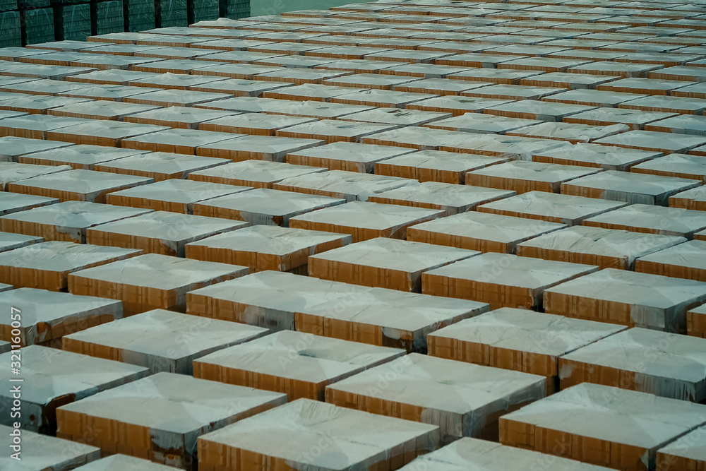 Bricks are stored in an open air warehouse. Red brick in pallets Stock ...
