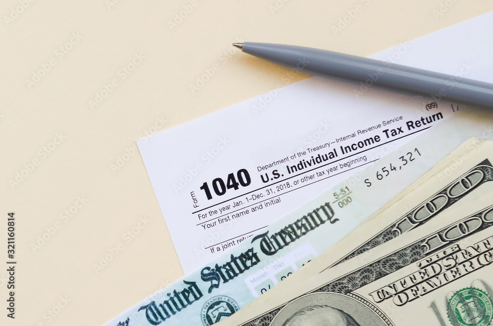 1040 Individual Income tax return form with Refund Check and hundred ...