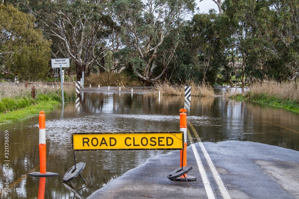 Road closed due to flooding showing road closed sign Stock Photo ...