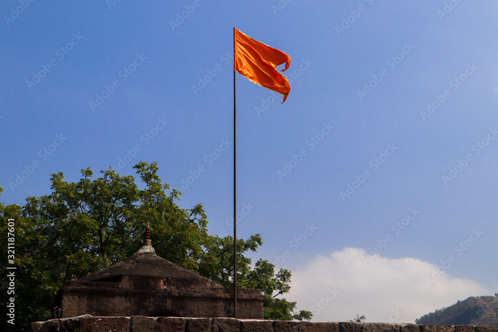 Saffron Flag Waving above a Hindu temple Stock Photo | Adobe Stock
