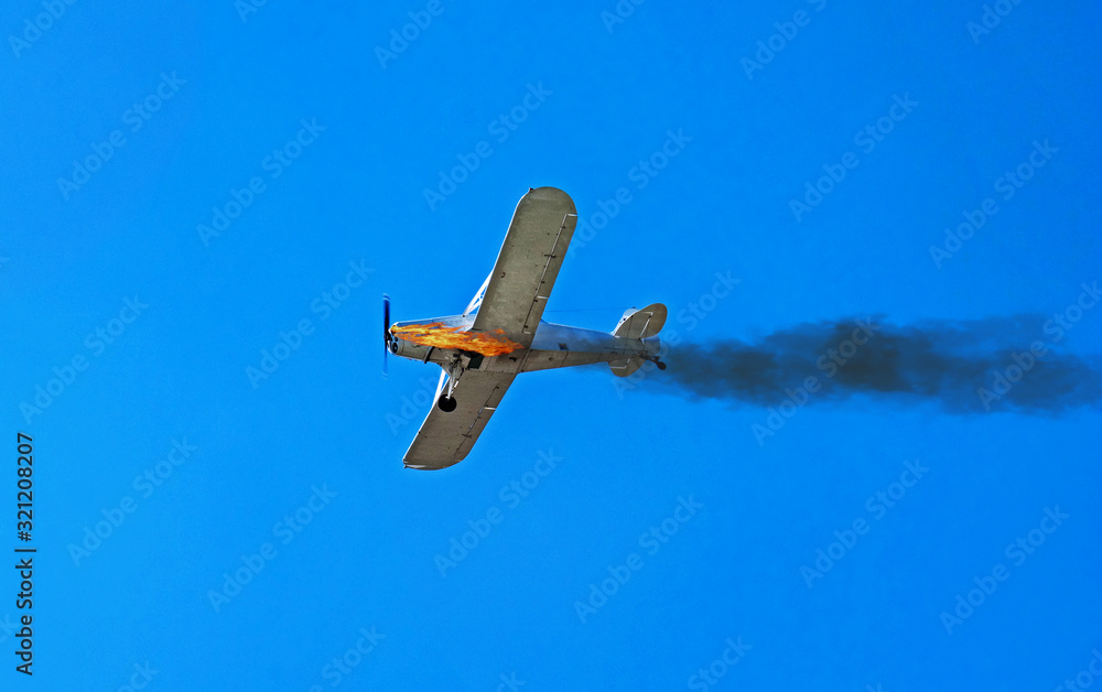 airplane burning in flight. The engine of the plane fired. Flames and ...