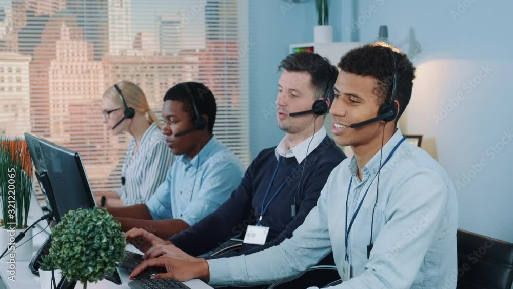 Multiracial call center agent feeling exhausted and broken-down after ...