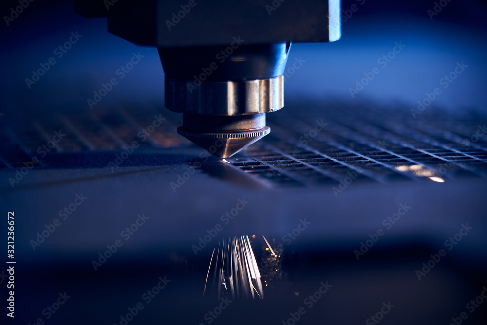 CNC Laser cutting of metal close up, modern industrial technology ...