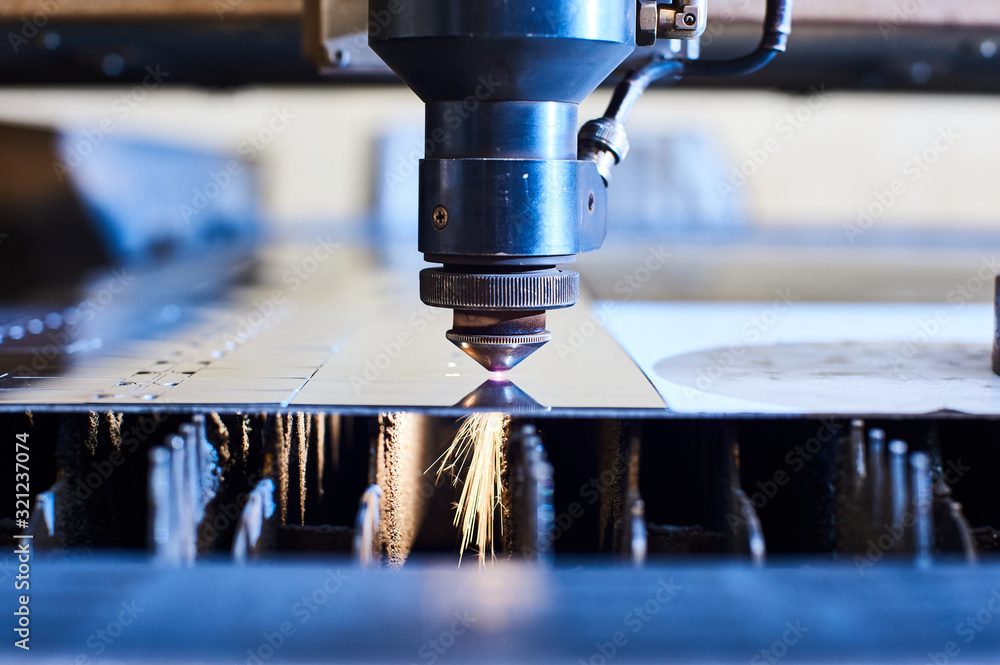 CNC Laser cutting of metal close up, modern industrial technology ...