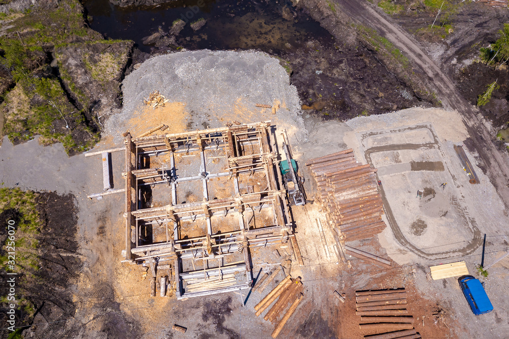 Aerial view of the construction site during the building of a wooden ...