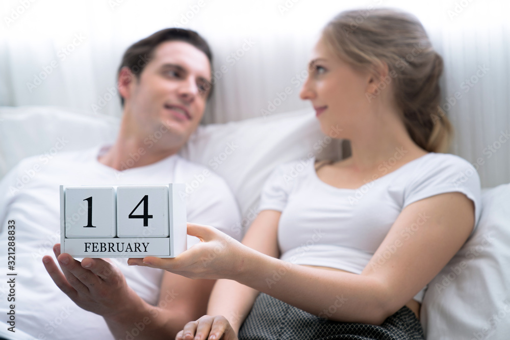 Couple on Valentine's Day, Romantic couples sitting on the bed in the ...