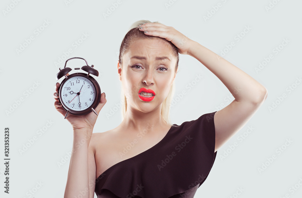 Time pressure. Closeup portrait woman stressed employee holding clock ...