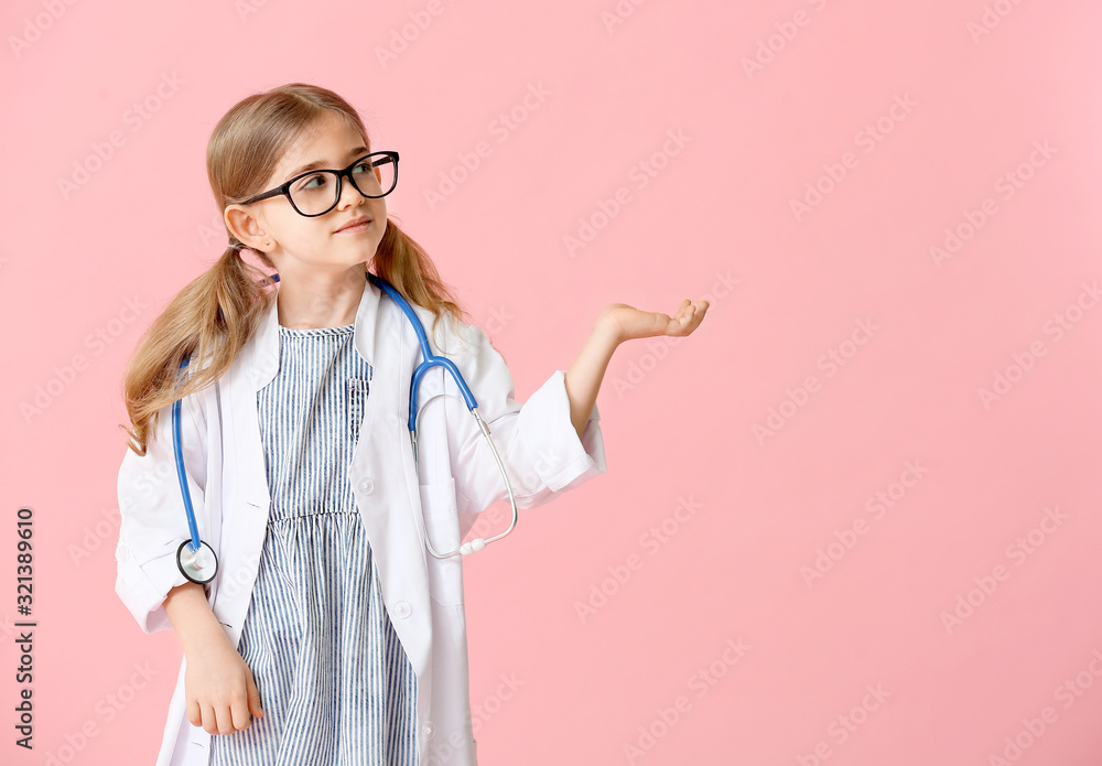 Cute little doctor on color background Stock Photo | Adobe Stock