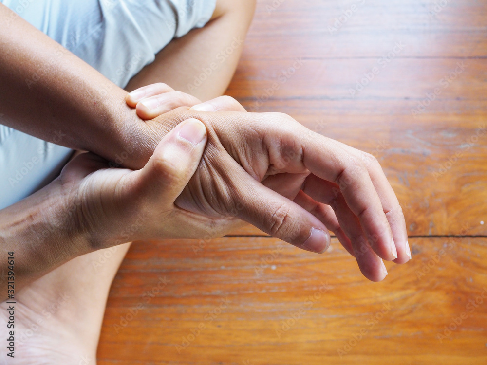 Asian women suffering from sore arms, Acute bone and wrist pain, Health ...